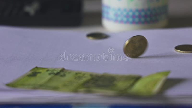 A Five-rupee Coin Spinning on the Table. Coin Turn or Spin on the Table ...