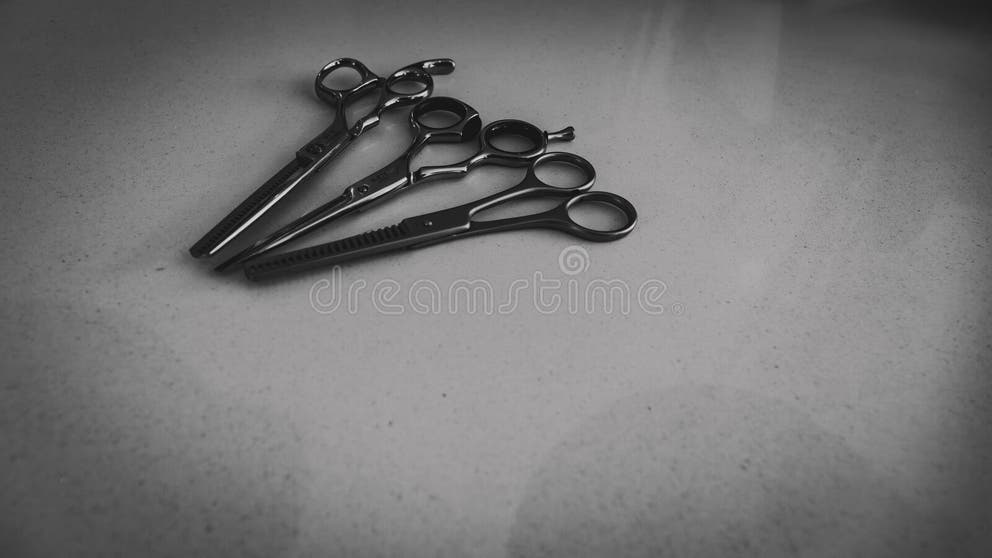 Five Scissors and a Piece of Steel are Shown on a Table Stock Image ...