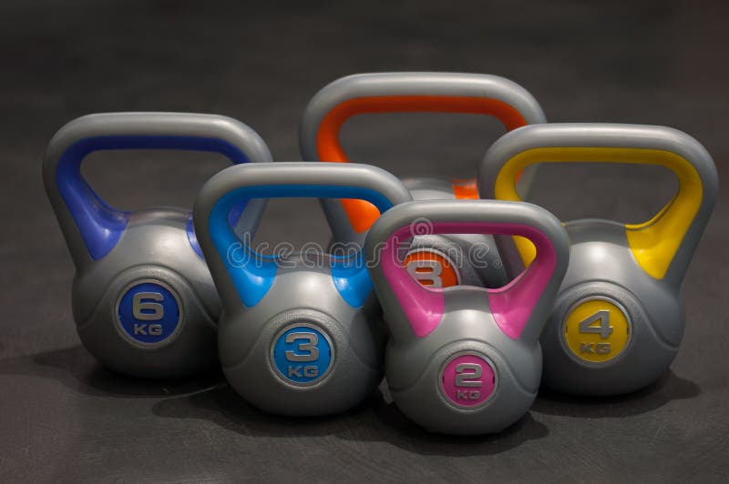 Five Several Plastic Weights of Different Weights and Colors Stock ...