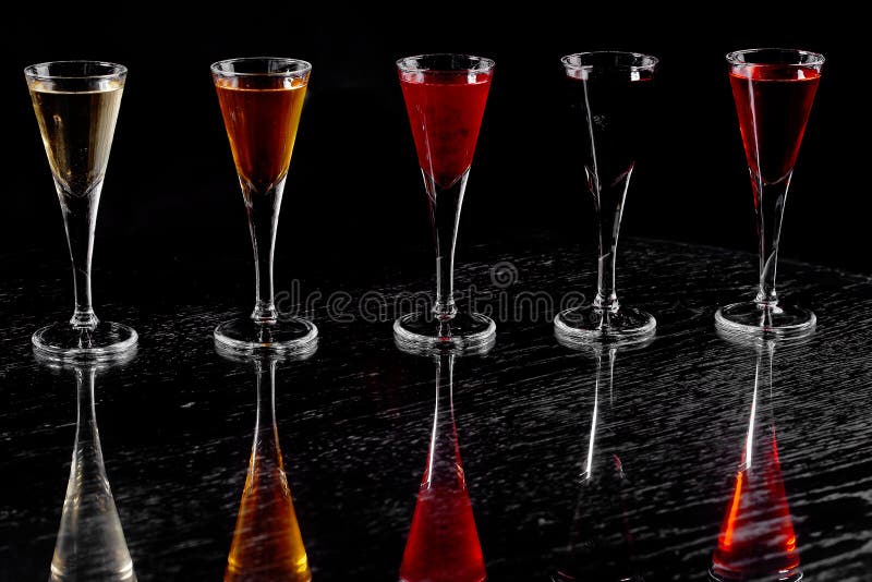 Five Shots on a Mirrored Table on a Black Counter Stand-up Stock Photo ...