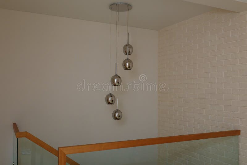 Five Silver Lamps Hanging from Ceiling, Modern Interior Lit ...
