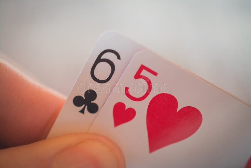 Five and Six, Playing Cards in Hand on the Table, Poker Nands Stock ...