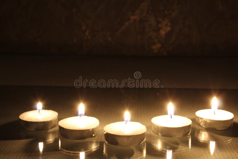 Five Small Candles Burn and Stand in a Triangle. Side View Stock Image ...