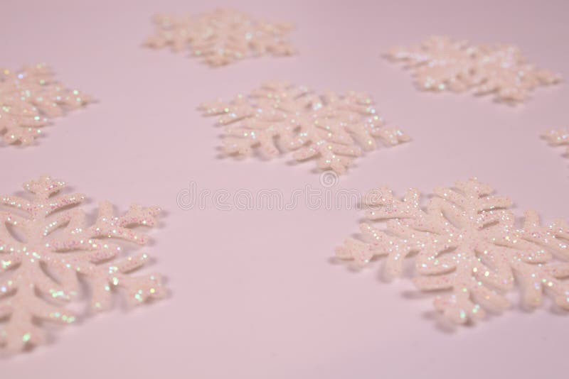 Five Snowflakes are Scattered on a White Surface Stock Image - Image of ...