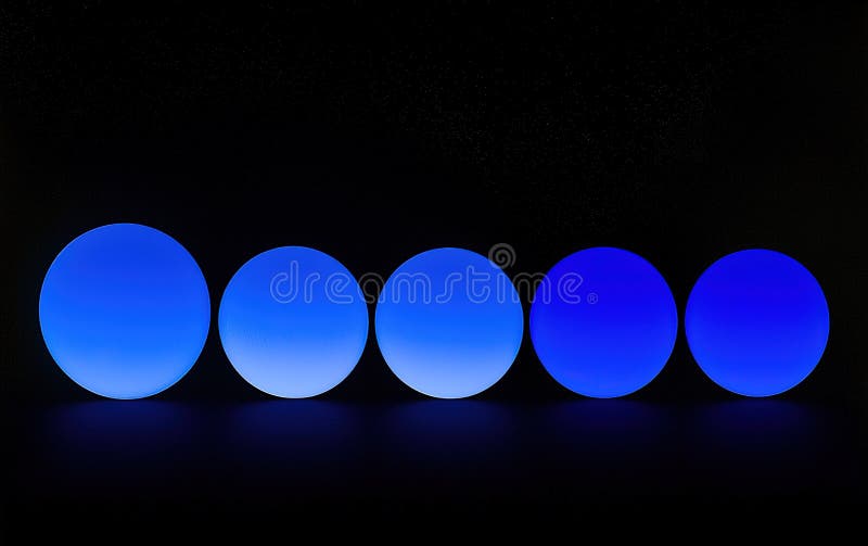 Five Spherical Shapes Glowing in Varying Shades of Blue Against a Dark ...