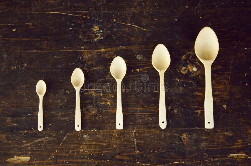 Five spoons on the table stock image. Image of brown - 71377381