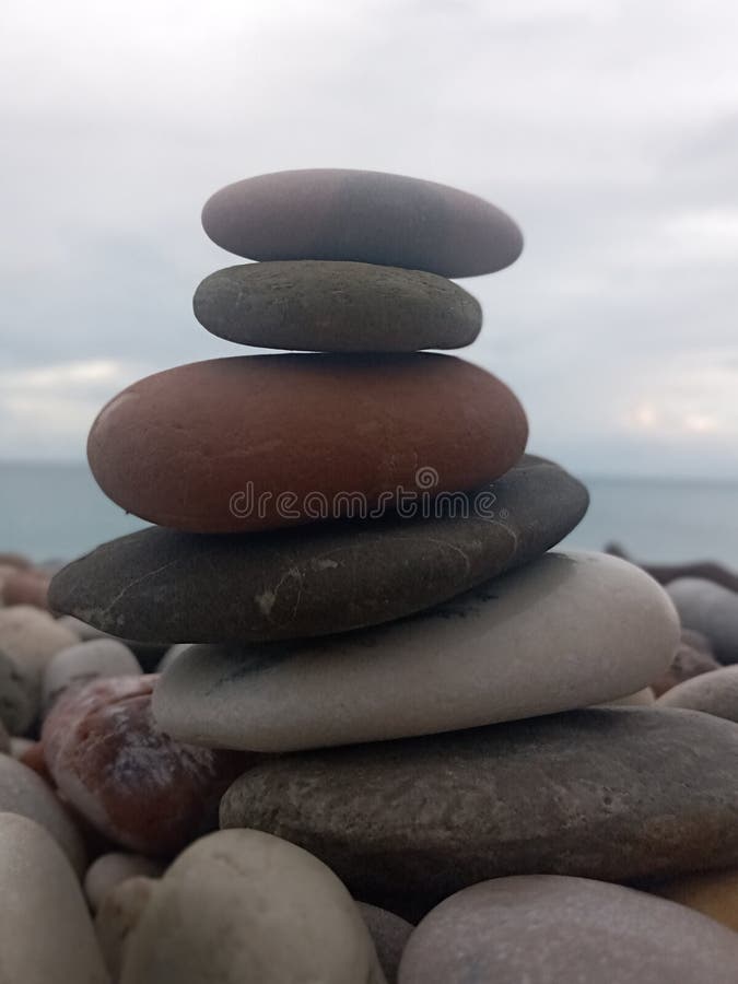 Five Stacked Stones on the Edge of Oetune Beach Stock Photo - Image of ...
