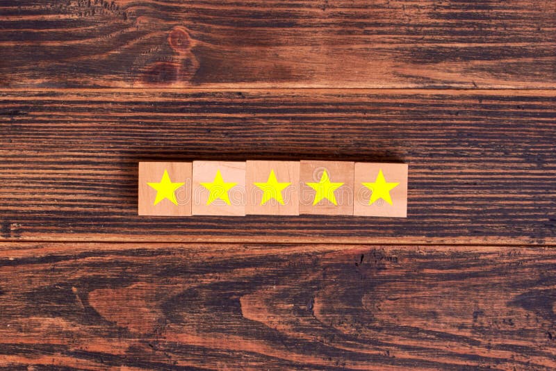 Five Star Symbol on Wooden Blocks. Customer Experience Survey and ...