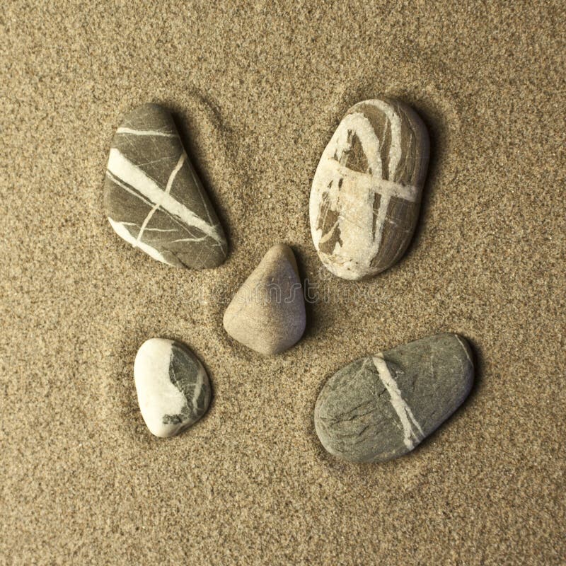Five stones in the sand stock image. Image of beauty - 51202489
