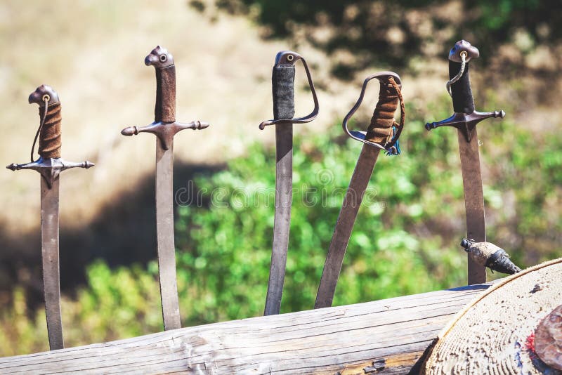 Five Swords Exhibited in a Row Stock Image - Image of tree, forged ...