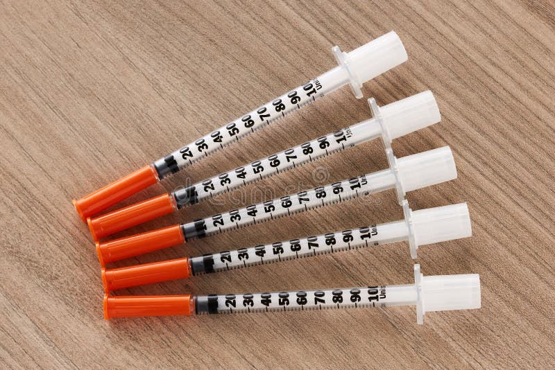 Five syringes on a table stock photo. Image of object - 66107090