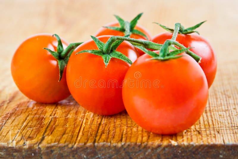 Five Tomatoes On The Vine Picture. Image: 4081264