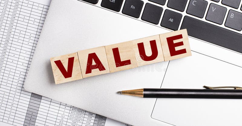 Five Wooden Cubes with the VALUE Text are Arranged in a Row on the ...