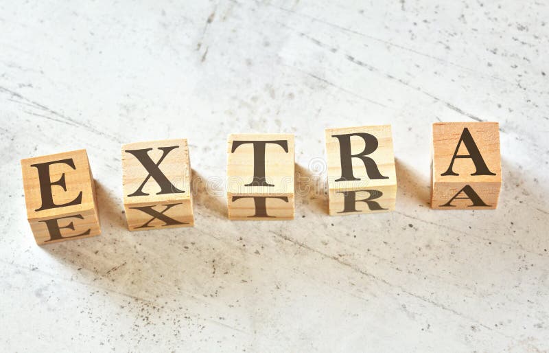 Word Extra Made with Black Letters on Wooden Blocks on Table Stock ...