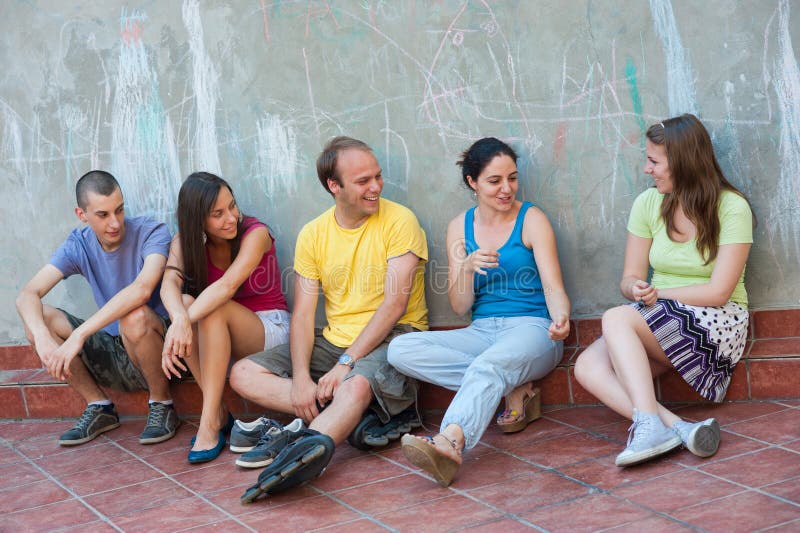 Five young people talking stock photo. Image of people - 25620424