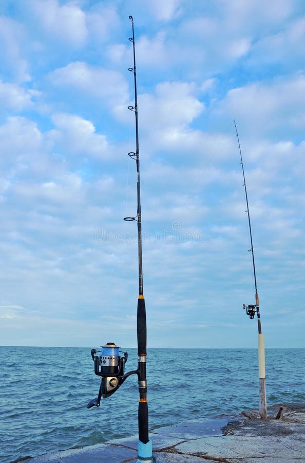 Fixed Fishing Rod Set Up in Front of the Sea Stock Photo - Image of ...