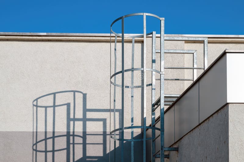 Fixed Steel Caged Ladder on Industrial Building Stock Photo - Image of ...