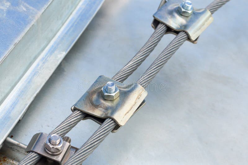 Fixing an Aluminum Ground Wire on the Galvanized Roof of the Building ...