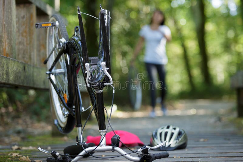 Fixing Broken Bicycle in Forest Stock Image - Image of ride, service ...