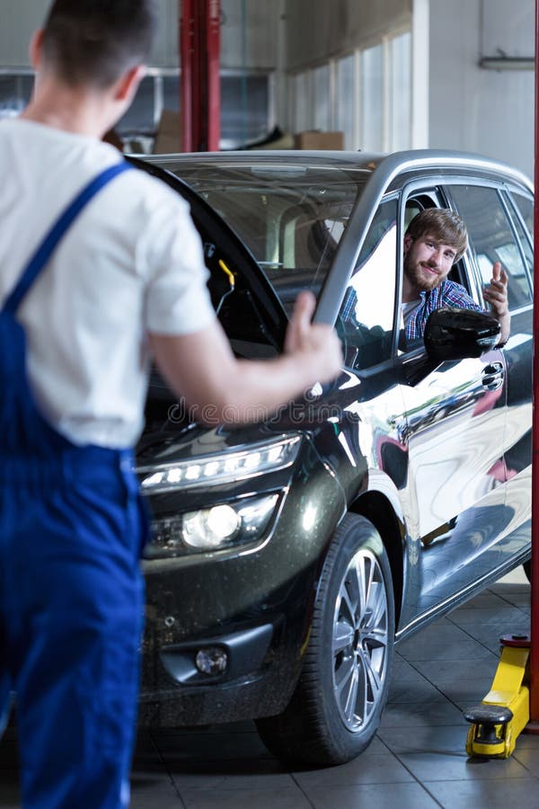 Fixing a car stock photo. Image of machinist, mechanic - 56423592