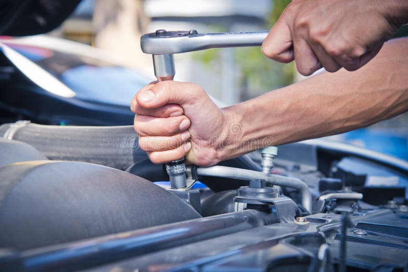 Fixing a car stock image. Image of occupations, automobile - 77562039