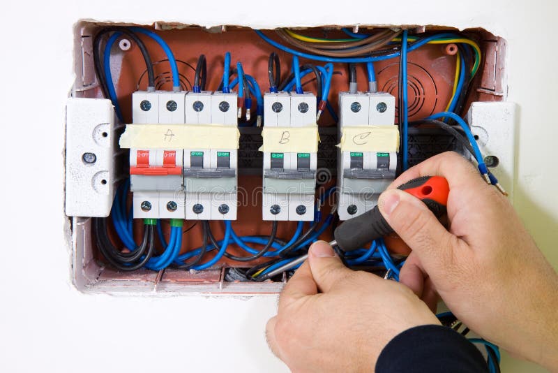 Fixing an electric plant stock photo. Image of helmet - 92025514