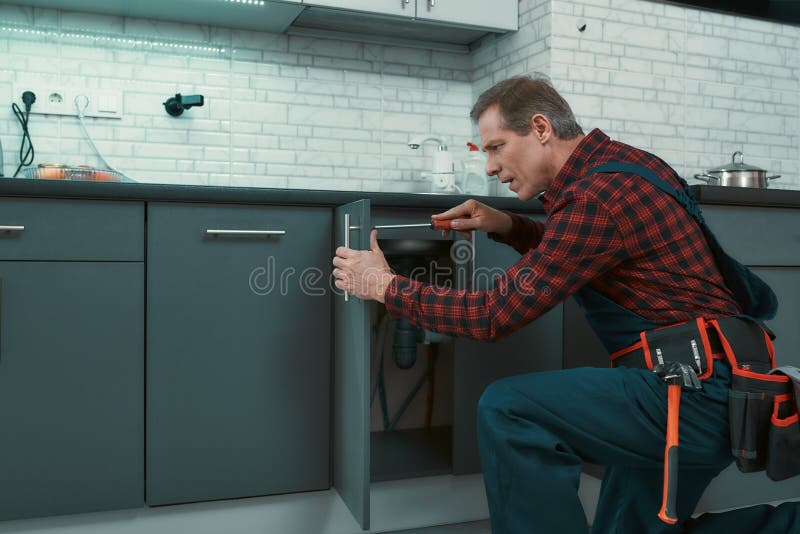 Fixing Everything. Man Solves Household Problems. Mature Man Wearing ...