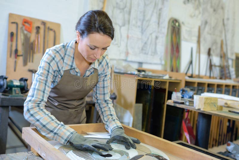 She fixing glass together stock photo. Image of material - 260341954