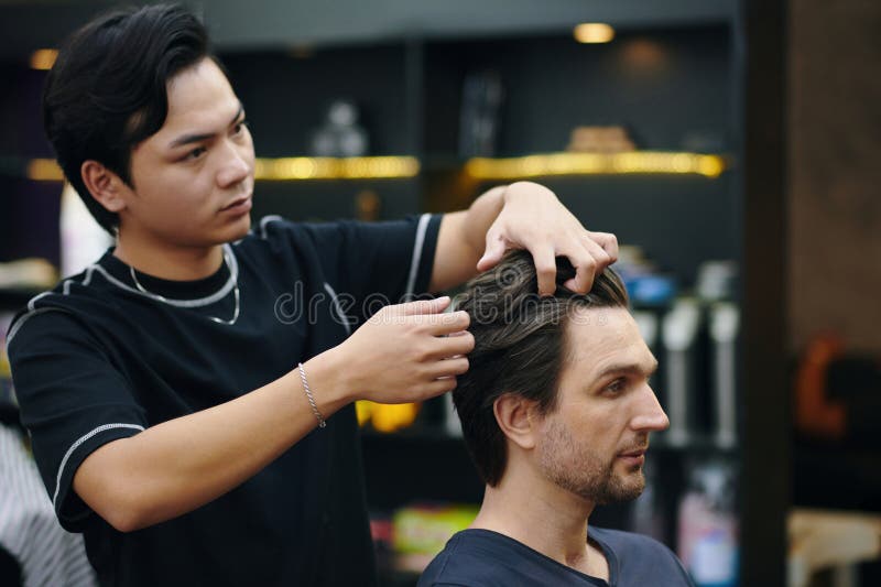 Fixing Hair with Styling Product Stock Photo - Image of male, beauty ...