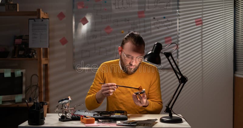 Fixing Laptop. Millennial Man Disassembling a Notebook and Cleaning Its ...