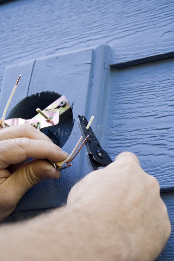 Fixing a Light Fixture stock photo. Image of self, exterior - 6295346
