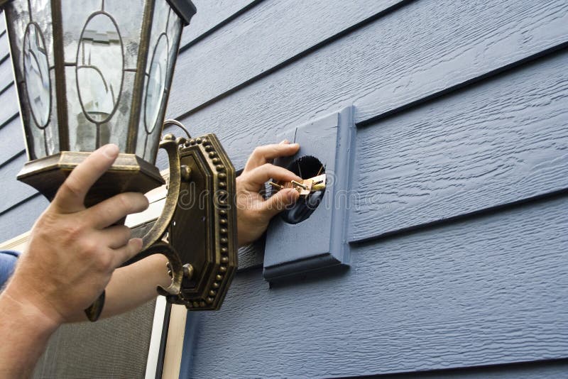 Fixing a Light Fixture stock image. Image of household - 6295567