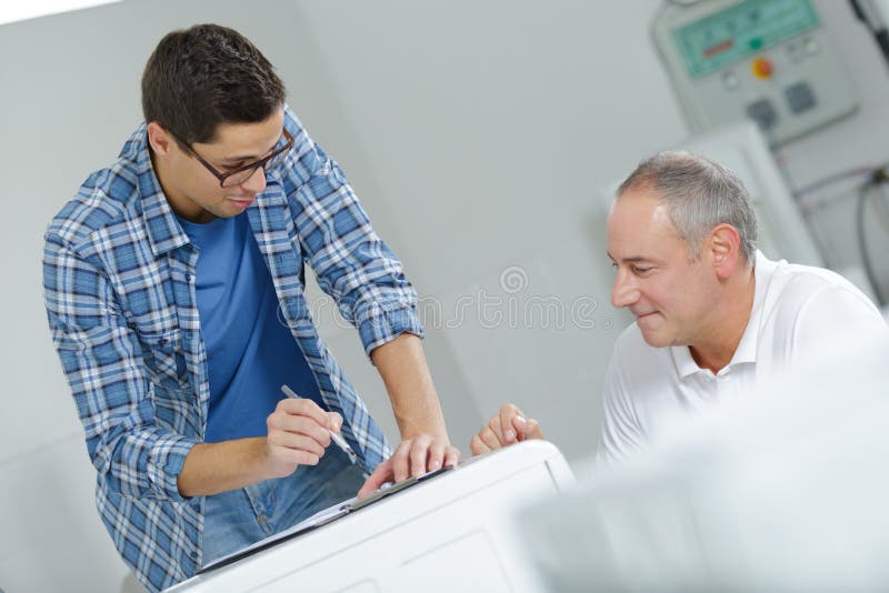 They fixing machine stock photo. Image of male, apprenticeship - 250115256