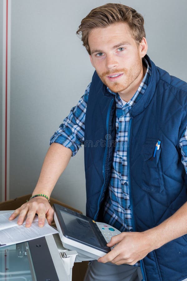 Fixing an office printer stock image. Image of labor - 128019535