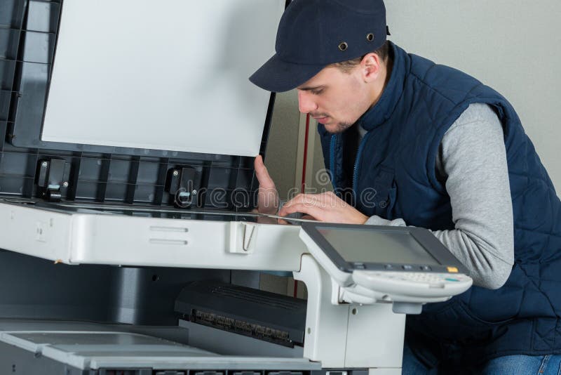 Fixing an office printer stock image. Image of fixing - 127764565