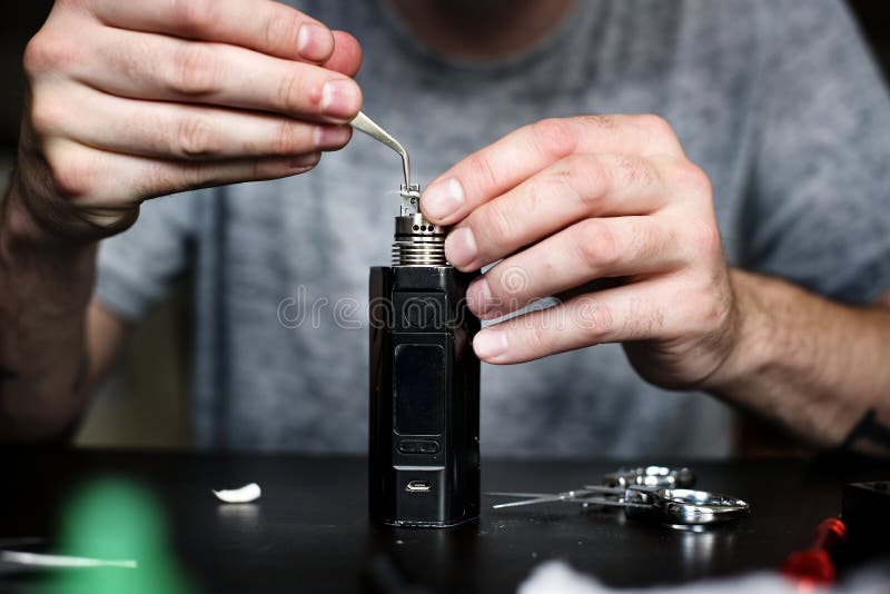 Using the Tools of the Trade. Two Photographers Sitting in Their Office ...