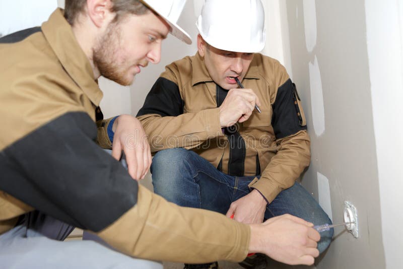 Fixing socket to wall stock image. Image of power, installing - 93831687