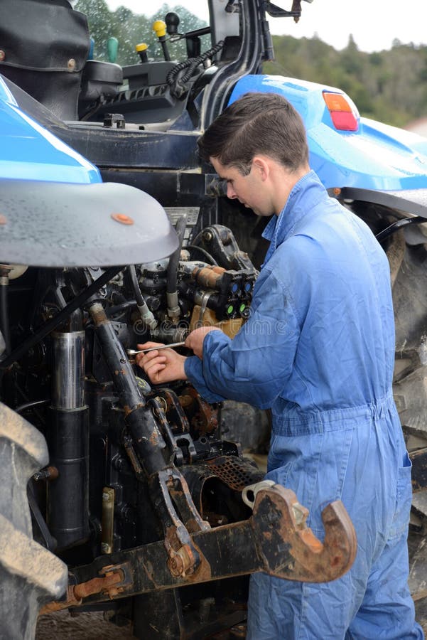 118 Man Fixing Tractor Stock Photos - Free & Royalty-Free Stock Photos ... 118 Man Fixing Tractor Stock Photos - Free & Royalty-Free Stock Photos ...