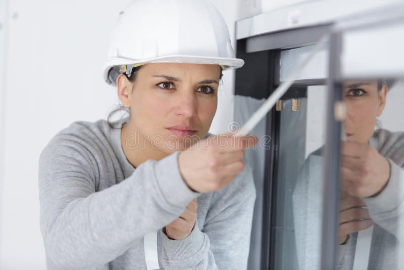 Fixing the window blinds stock photo. Image of technician - 210148080
