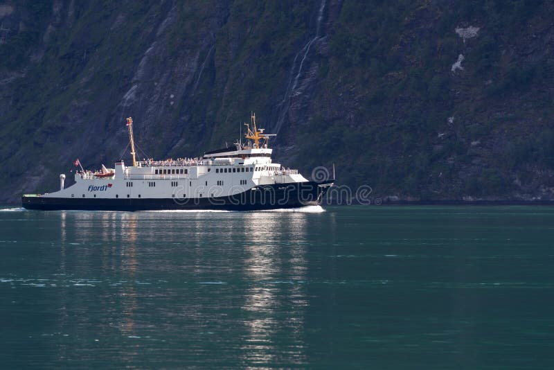 Fjord1 Ferry Sailing with Passengers Inside Geiranger Fjord in Norway ...