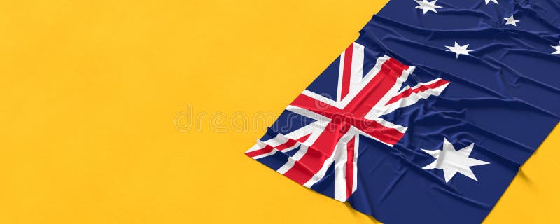 Flag of Australia. Fabric Textured Australia Flag Isolated on Yellow ...