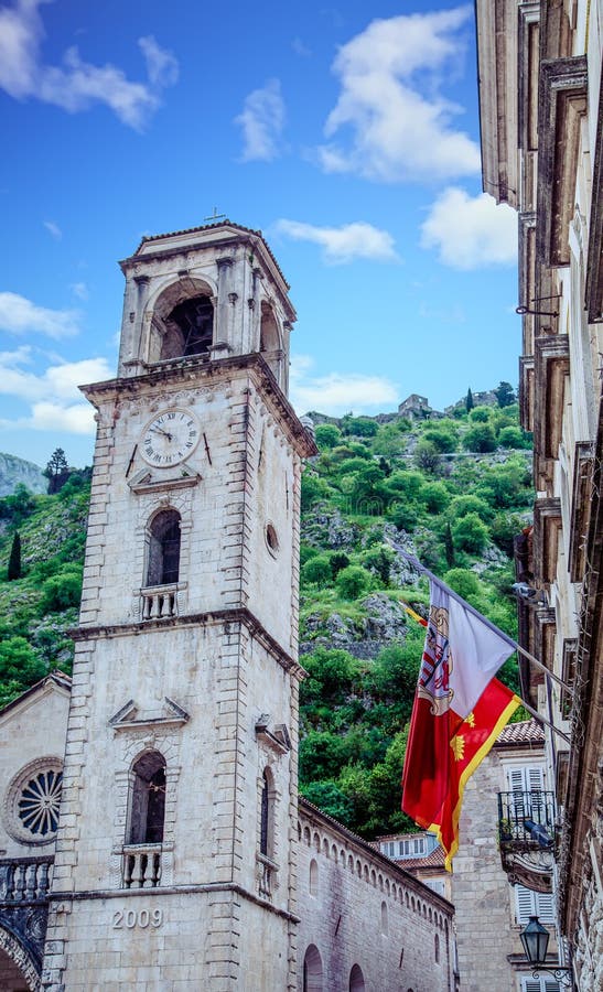 Flag and Clock Tower in Kotor Stock Image - Image of religion, flag ...