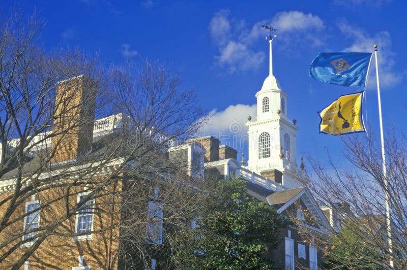 Flag of Delaware Being Waved in the Breeze Against a Sunset Sky and the ...