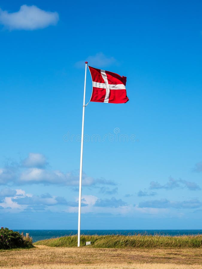 The Flag of Denmark with Blue Sky Stock Image - Image of vertical, flag ...