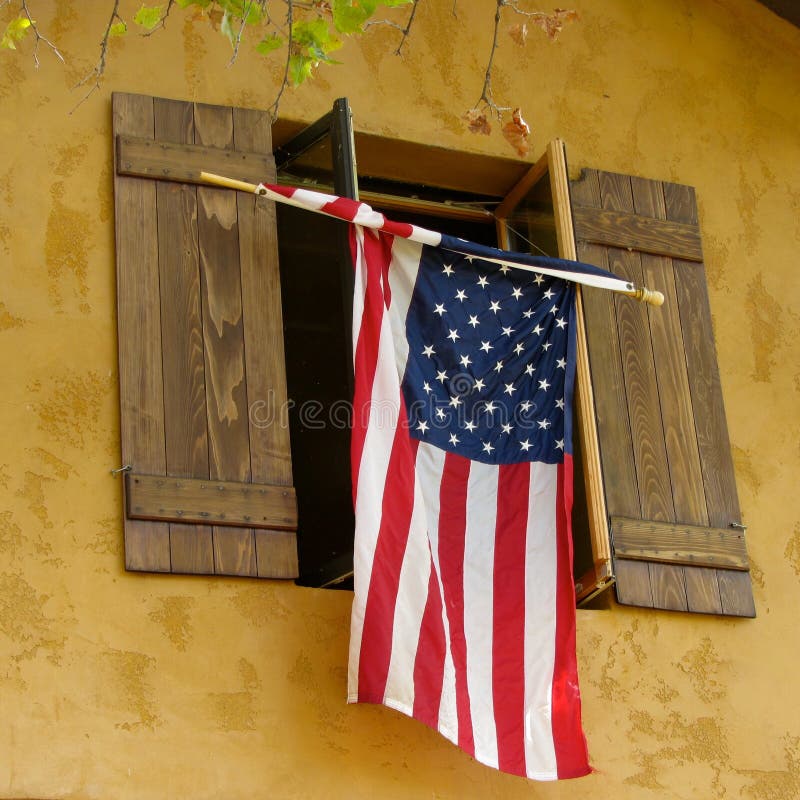 Flag hanging from shutters stock image. Image of patriotic - 36168827