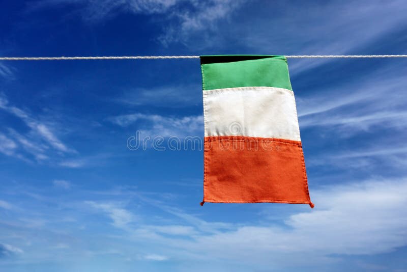 Flag of Italy Hanging on a Rope Against a Blue Sky Stock Image - Image ...