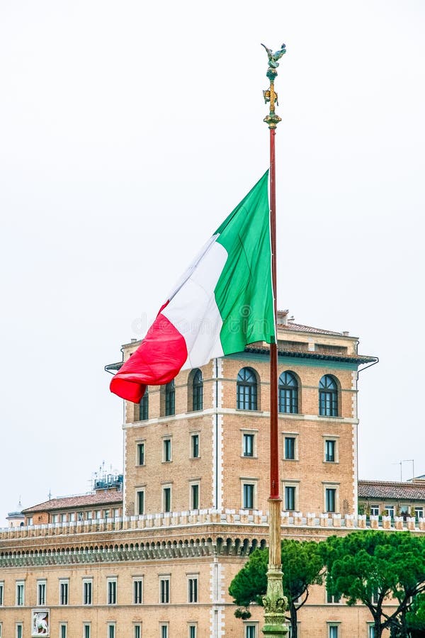 A Flag of Italy in Roma is Flying in Front of a Building Stock Image ...