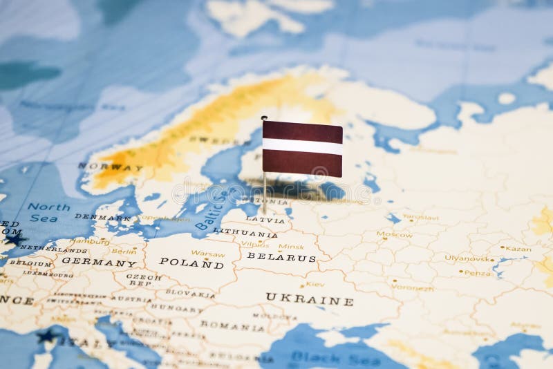 The Flag of Latvia in the World Map Stock Photo - Image of land, city ...