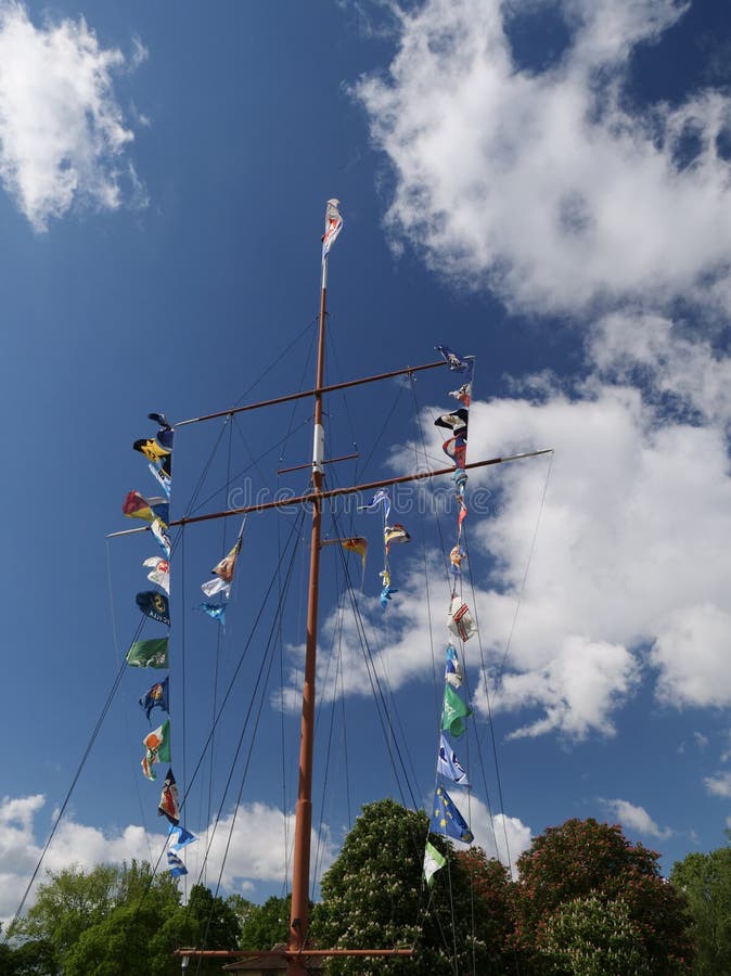 Flagstaff Against Blue Sky with Flags in Strong Wind Stock Photo ...