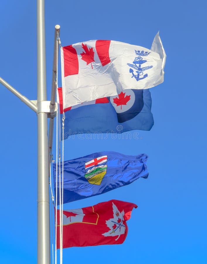 A Flag Pole with Several Army Flags from Canada Alberta Waving during Remembrance Day Editorial ...